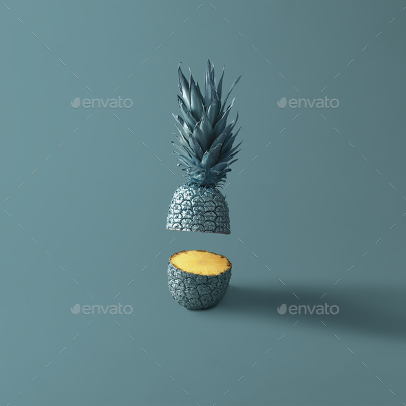 Cut blue pineapple on blue background with copy space. Stock Photo by ...