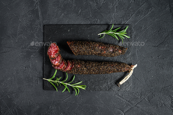 Fuet, Salami and a sprig of rosemary. Traditional Spanish sausage ...