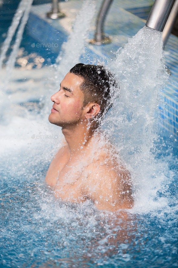 Handsome man in hydrotherapy pool Stock Photo by Juan_Algar | PhotoDune