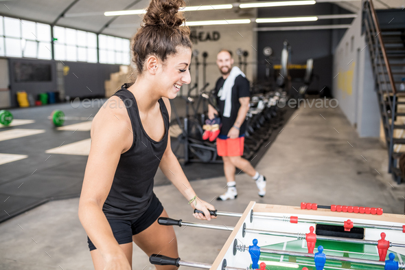 Fitness athletic woman playing table soccer Stock Photo by peus80 ...