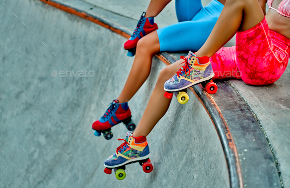 Beautiful attractive Caucasian women in skate park rollerblading ...