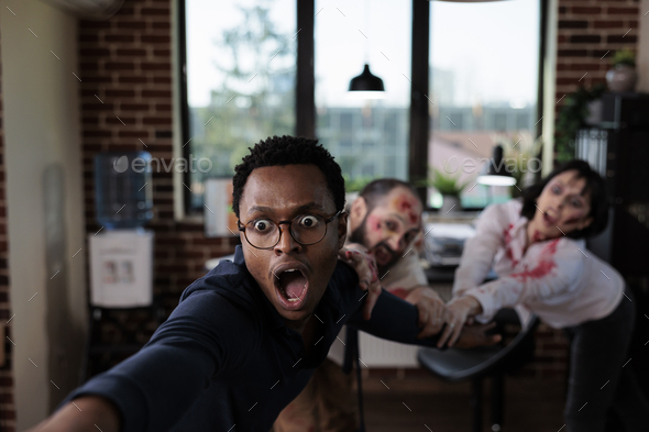 Scared man running from creepy zombies Stock Photo by DC_Studio | PhotoDune