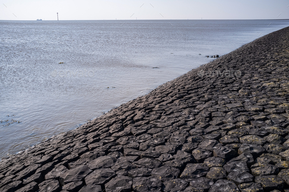 Cobblestone embankment. The seashore, fortified with stones from ...