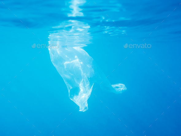 plastic bag floating under the sea water Stock Photo by Raul_Mellado