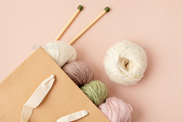 Craft hobby background with yarn in natural colors Stock Photo by OksaLy