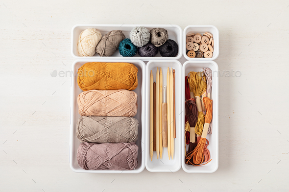 Craft hobby background with yarn in natural colors Stock Photo by OksaLy