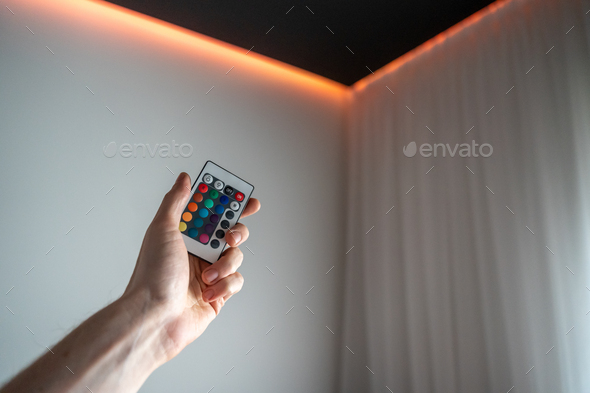 Hand with led lighting remote control Stock Photo by molenira | PhotoDune