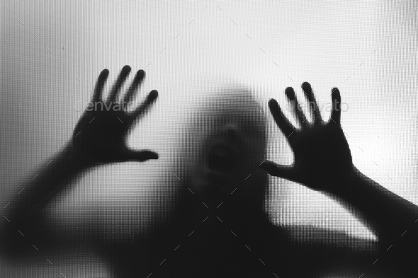 Shadowy figure behind glass - horror background Stock Photo by erika8213