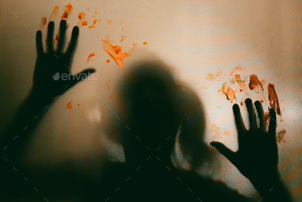 Shadowy figure, child with blooded hands behind glass - horror ...