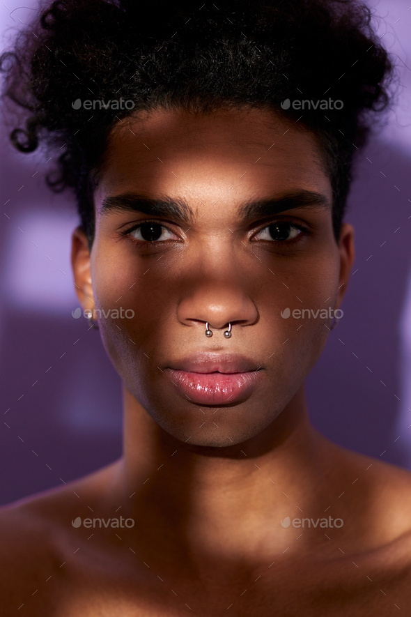 Close up verticale portrait of young man face in shadow and texture ...