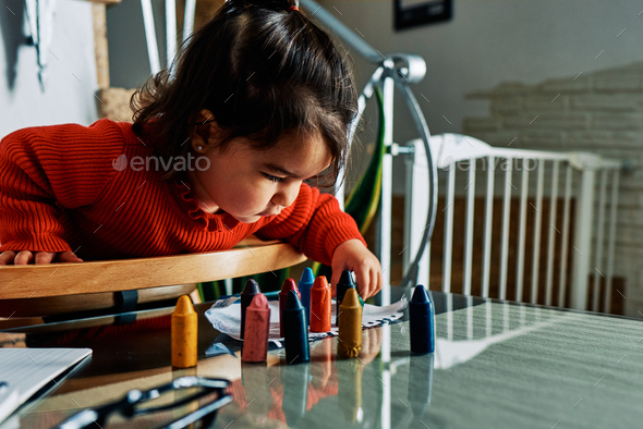 little girl picking up crayons Stock Photo by yosss1 | PhotoDune