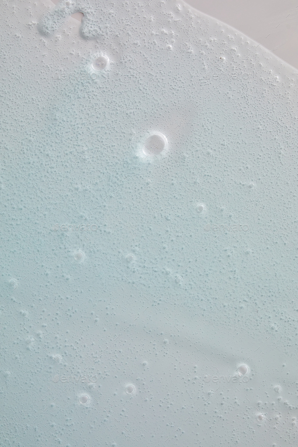 Blue cream liquid gel serum flows down on silver texture Stock Photo by ...