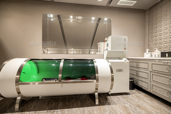 Woman lying in oxygen capsule Stock Photo by RossHelen | PhotoDune