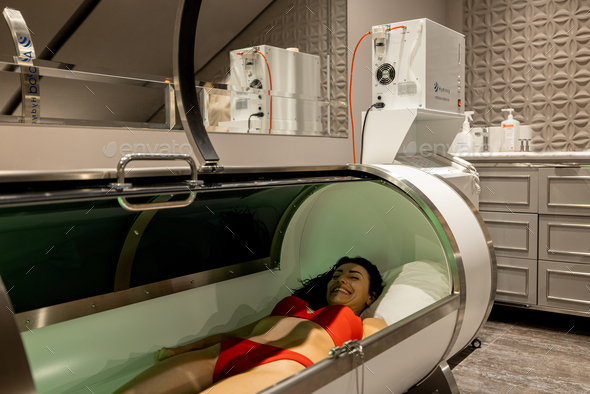 Woman lying in oxygen capsule Stock Photo by RossHelen | PhotoDune