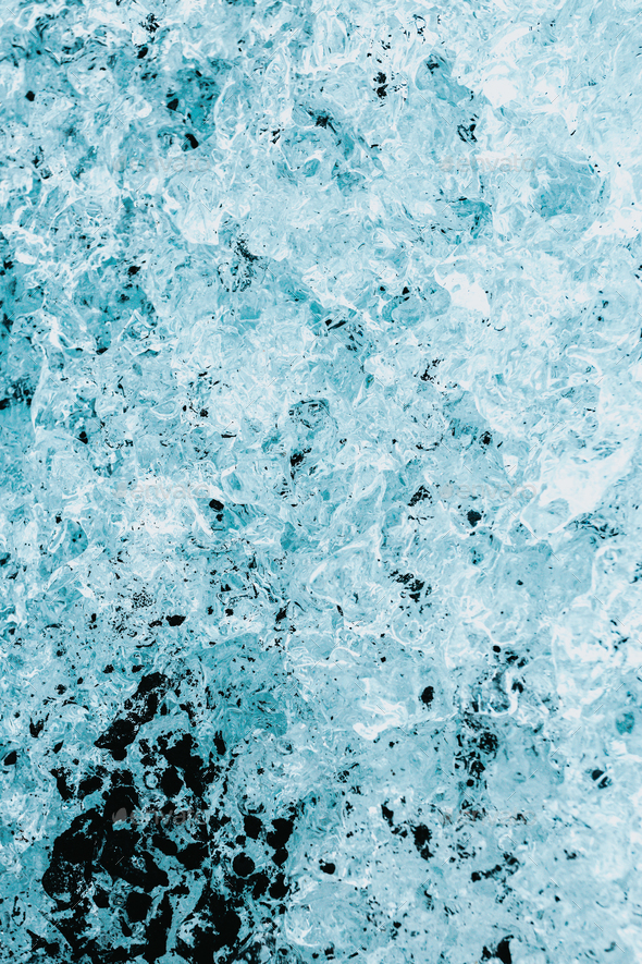 Iceland blue ice abstract background with volcanic black. Blue ...