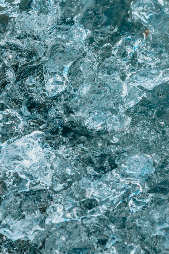 Iceland blue ice abstract background with volcanic black. Blue ...