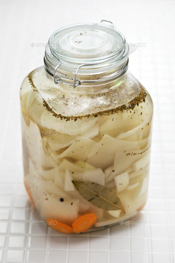 Cueritos is a Mexican vinegared pickled pork rinds. Stock Photo by motghnit