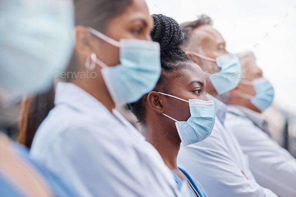 Hospital workers are heroes. Closeup shot of a group of doctors wearing ...