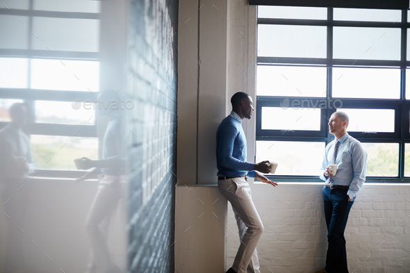 Coming up with a solid plan of action. Shot of two businessmen having a ...