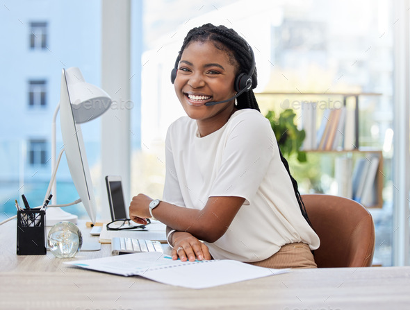 Shot of a young female call center agent using a computer at work Stock ...