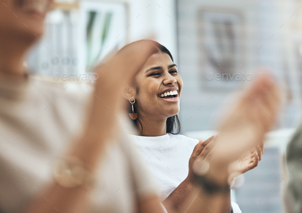 Shot of a group of people clapping and smiling during a meeting at work ...