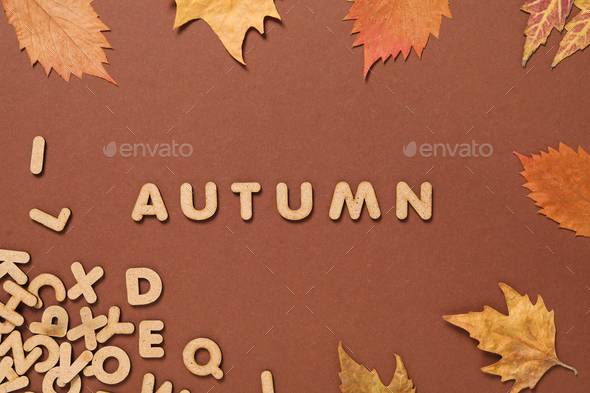 Word Autumn, letters and leaves on brown background Stock Photo by ...