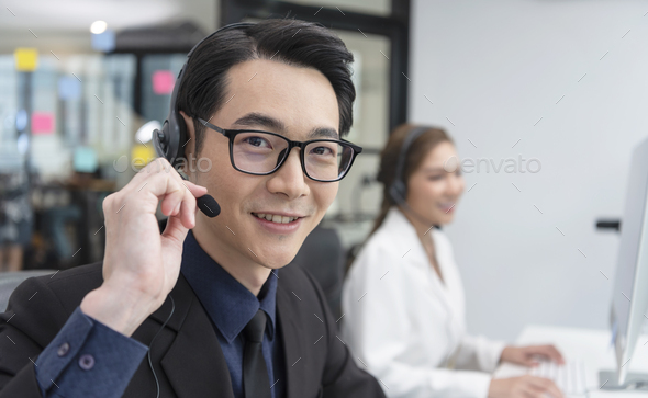 Asian call center agent team, customer service support wearing headset ...