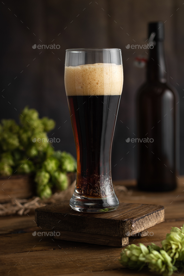 Beer. A tall glass of beer, with foam. Beer concept. Stock Photo by ...
