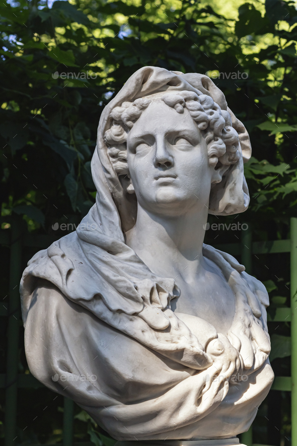 Close-up of sculpture woman's head made of white marble. Old statue of ...