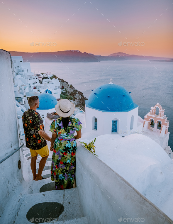 Couple of men and women on vacation in Santorini Greece, couple visit ...