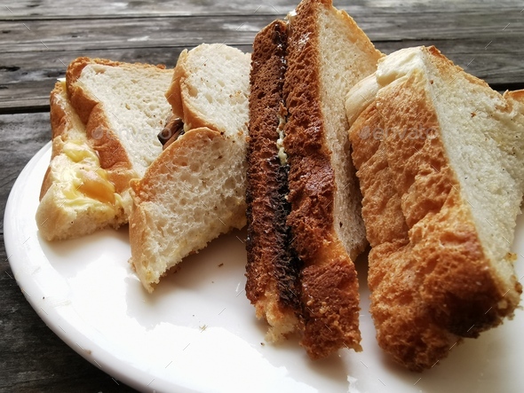 Image of kaya butter toast on white plate. Stock Photo by Ekahardiwito