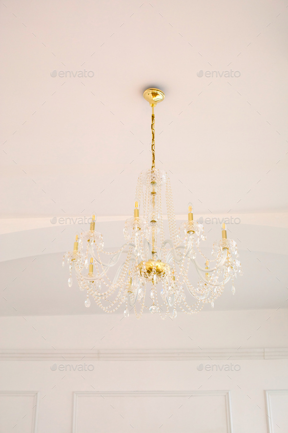 Crystal chandelier hanging on white ceiling Stock Photo by Demkat ...