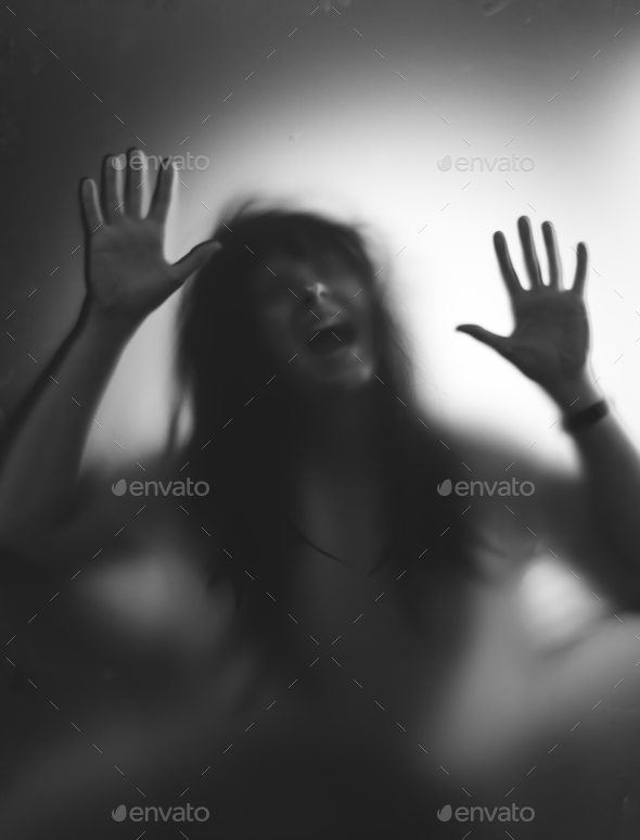Shadowy figure behind glass - horror background Stock Photo by erika8213