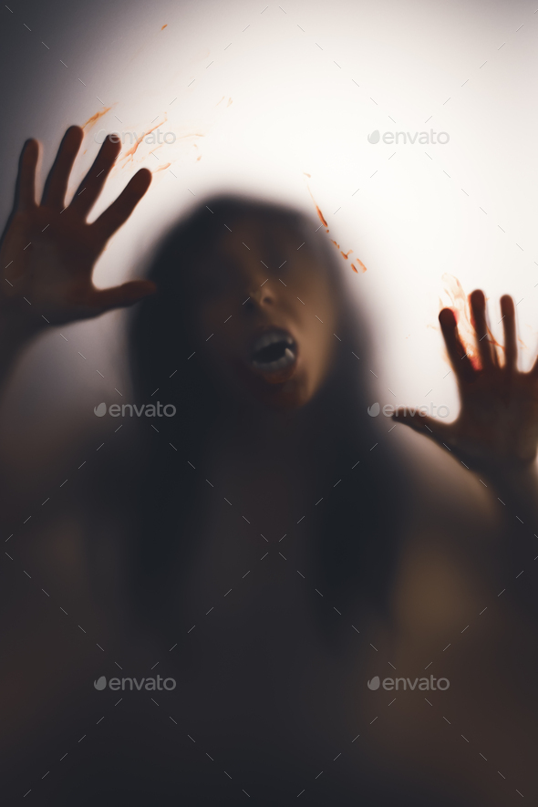 Shadowy vampire figure with blood behind glass - horror background ...