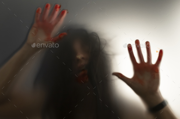 Shadowy figure with blood behind glass - horror background Stock Photo ...