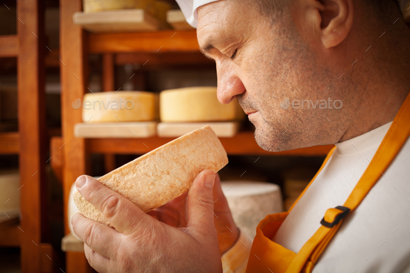 male, man cheese maker businessman, individual entrepreneur, checks ...