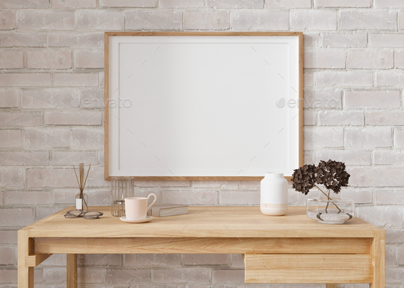 Empty horizontal picture frame on white brick wall in modern living ...