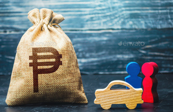 Couple figurines and philippine peso money bag. Stock Photo by iLixe48