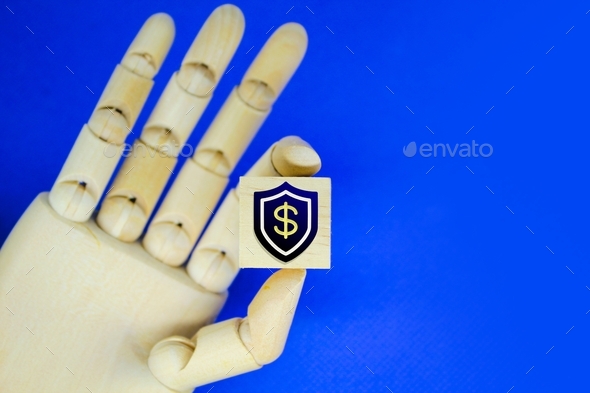 wooden hand holding Safety money icon. the concept of financial ...