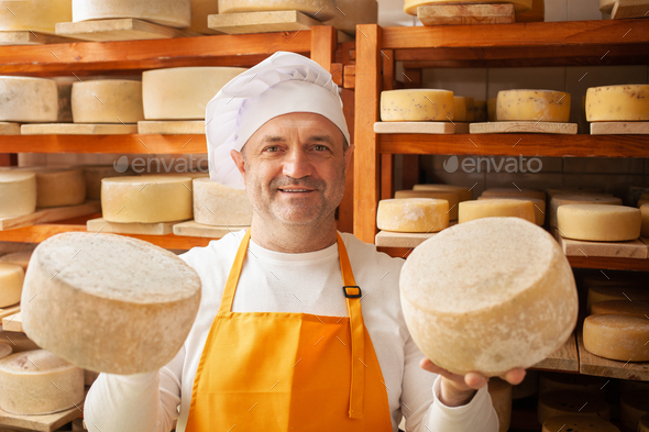 male, man cheese maker businessman, individual entrepreneur, checks ...