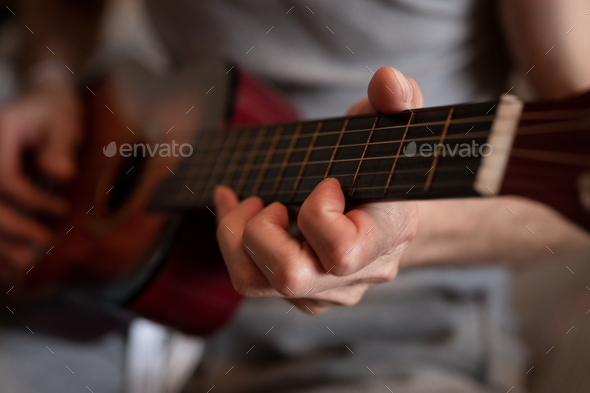 male hands elderly senior man holding playing classical guitar at home ...