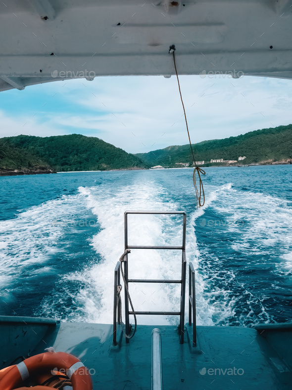 View from inside of the boat and water ripples with islands. Stock ...