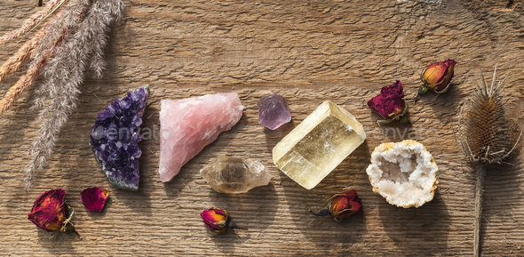 Colorful healing crystals and minerals in a row Stock Photo by Portoprens