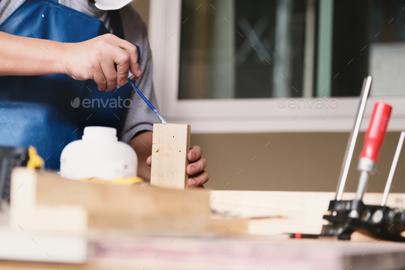 Woodworking operators are using glue to put together the wood parts to ...
