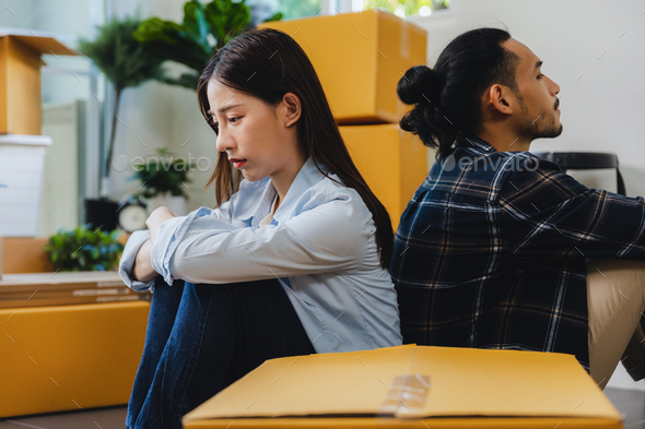 Sad and stress love couple unemployment unhappy packing box to get out ...