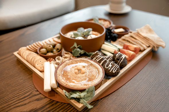 Traditional arabic breakfast: eggs, olives, hummus, pitta bread ...