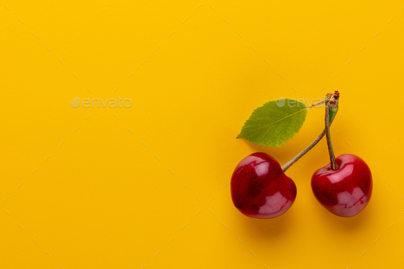 Cherry berries on a pastel background top view. Background with a ...