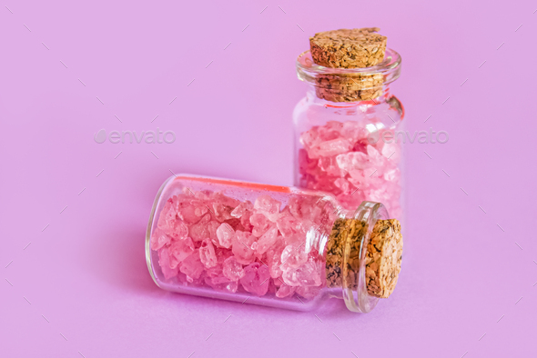 Himalayan pink salt in glass jars on pink background. Himalayan pink ...