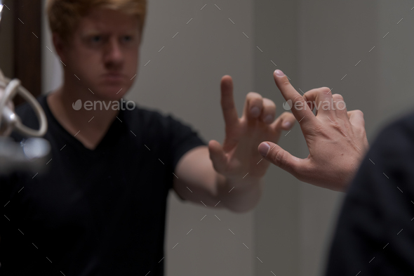 man reaching out to his reflection Stock Photo by wizardrebel | PhotoDune
