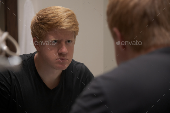 Sad man looks at his reflection Stock Photo by wizardrebel | PhotoDune